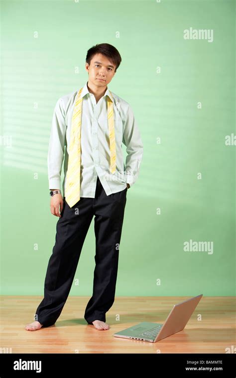 Man Standing Beside Laptop Computer Stock Photo Alamy