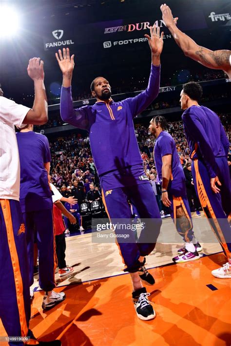 Kevin Durant of the Phoenix Suns walks on to the court before the ...