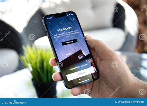 Man Hand Holding Apple IPhone 14 Satellite Internet Service StarLink Editorial Stock Photo