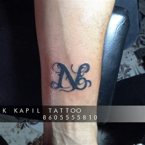 Letter N In Cursive Tattoo