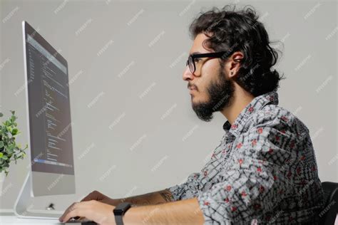 Premium Photo Focused Developer Coder Wears Glasses Working On