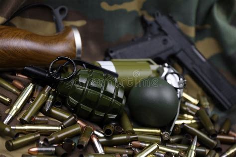 Different Types Of Ammunition On A Camouflage Background Preparing For
