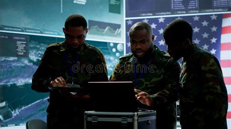 Military Officer In A High Tech Control Center Engages In Cybersecurity Operations Stock Image