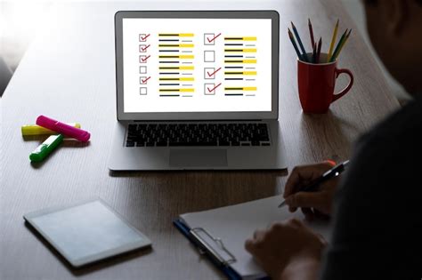 Premium Photo Midsection Of Woman Using Laptop On Table