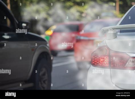 Air Pollution From Car Exhaust Smoke Traffic In The City Reducing