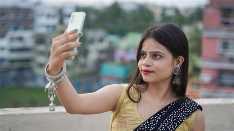 Premium Photo Beautiful Indian Girl Taking Selfie On Her Mobile Phone