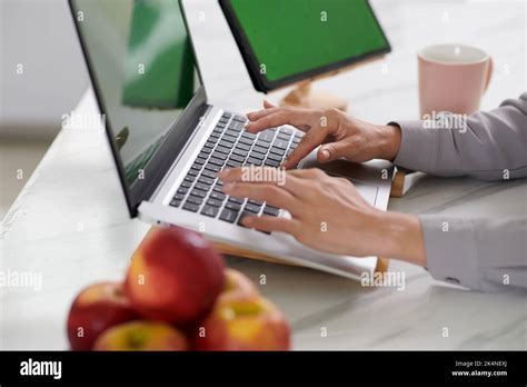 Side View Of Hands Of Young Webdesigner Pressing Keys Of Laptop Keypad