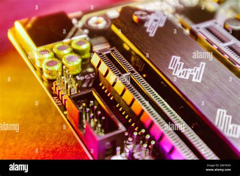 Motherboard With Sockets And Microchips Close Up On Desktop Pc In Colorful Vivid Light Computer