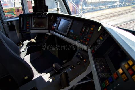 Modern Train Control Panel With Illuminated Buttons In A Dimly Lit