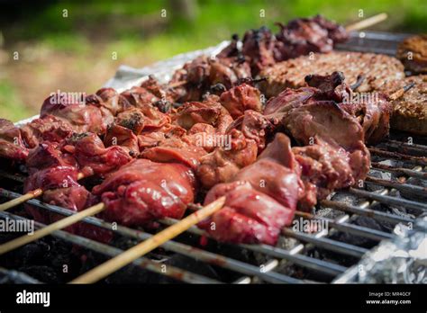 Different Types Of Meat Are Cooked On The Grill Close Up Stock Photo Alamy