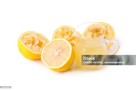 Glass Bowl Of Freshly Squeezed Lemon Juice Lemon Squeezer And Ripe ...