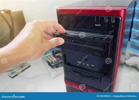 Man S Hand Inserting Cd Rom Into Computer Case Stock Image Image Of