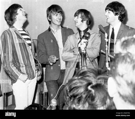 John Lennon Left Gives A Big Guffaw During Beatles Press Conference