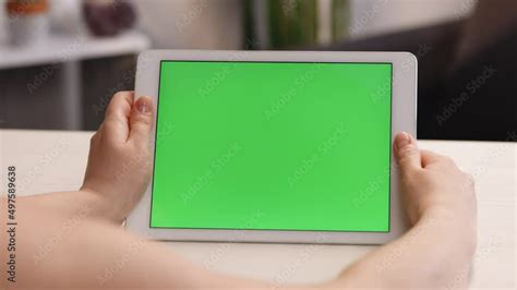 Close Up Horizontal Hands Holding Tablet Computer With Green Screen For