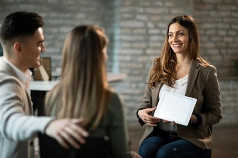 Free Photo Smiling Financial Advisor Having A Meeting With Young