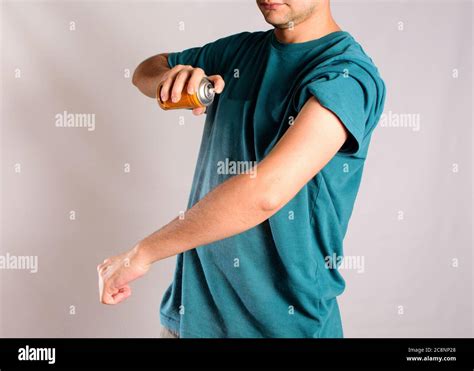 Elderly Female Spraying Insect Repellent On Skin Insect Bite