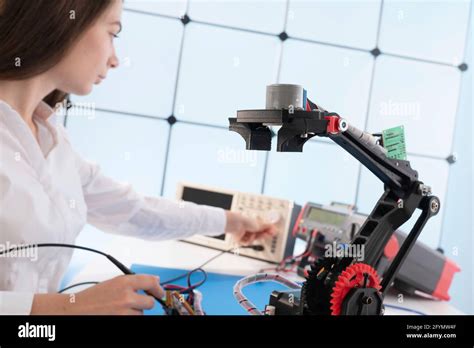 Student With Robot Model Arm Stock Photo Alamy
