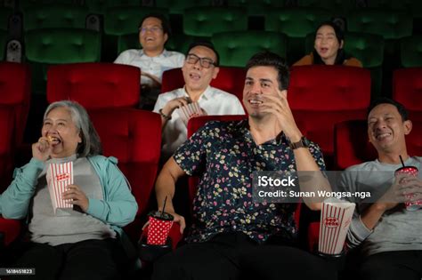 Group Of Asian Senior Friends Watching Comedy Movie And Laugh At The