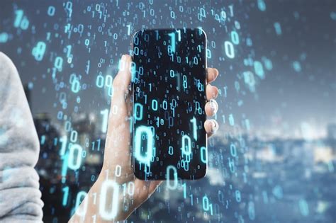 Premium Photo Close Up Of Female Hand Holding Mobile Phone With Creative Binary Coding On