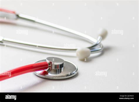 Red Stethoscope In Doctors Office For Professional Cardio Checkup And Healthy Heartbeat Pulse