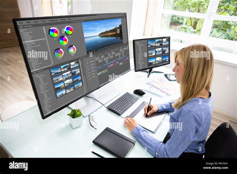 Female Editor Using Graphic Tablet While Editing Video On Computer Stock Photo Alamy