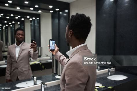 Businessman Taking Selfie In Public Restroom Stock Photo - Download ...
