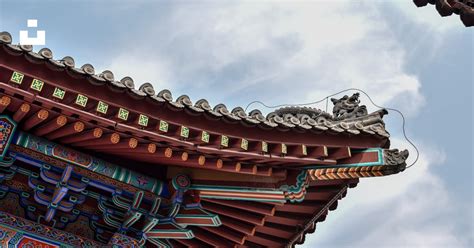 White Cctv Camera On Brown Roof Photo Free Building Image On Unsplash