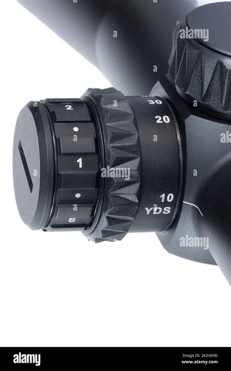 Reticle Brightness And Parallax Controls On A Riflescope On White Stock