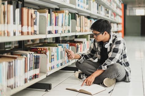 Premium Photo Male Student Working Assignment Browsing Using Premium Photo Male Student Working Assignment Browsing Using