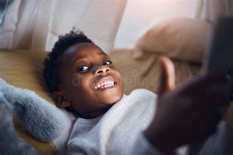 I Dont Know What Id Do Without My Tablet A Little Boy Using His