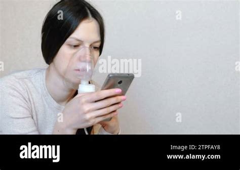 Use Nebulizer And Inhaler For The Treatment Young Woman Inhaling