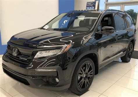 Black Honda Pilot Suv In Showroom