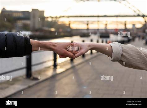 An Unrecognisable Couple Spending The Day In Newcastle Upon Tyne Together They Are Fist Bumping