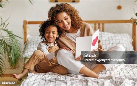 Cute Little Son Giving His Mom Greeting Postcard On Mothers Day