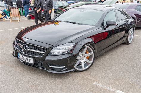 A Candid Shot Of A Sleek Black Mercedes Benz Sports Car With Alloy