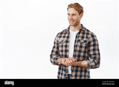 Handsome Friendly Looking Redhead Man Holding Hands Together In Polite