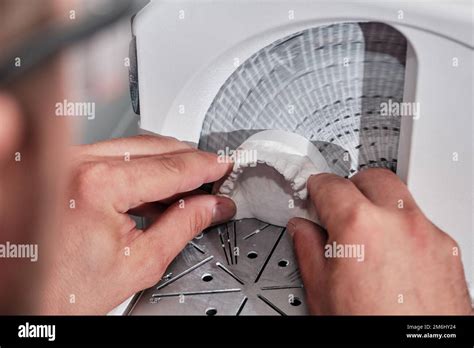 Dental Technician Trimming Excess Material From Plaster Models Dental