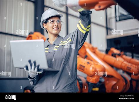 Engineer Woman Team Worker Work In Machine Robotic Modern Automation