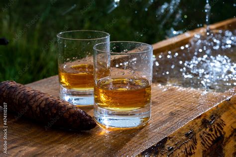 Glasses Of Strong Scotch Single Malt Whisky And Rain Water Drops Stock