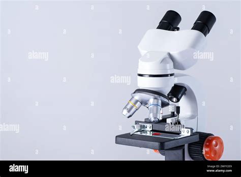 Microscope On White Background With Copy Space Blood Sample On A Glass