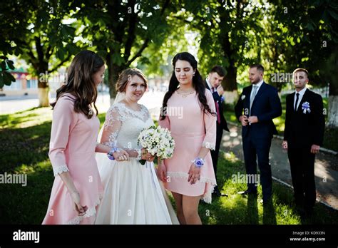 Wedding Couple Posing And Having Fun With Bridesmaids And Groomsmen In