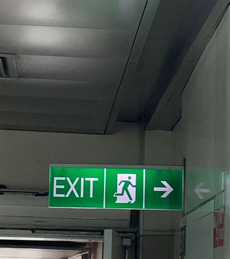 Modern Exit Sign Hanging From Ceiling