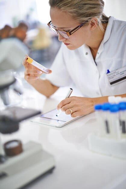 Premium Photo Woman Laboratory And Writing With Vial For Experiment Test Or Exam In Laboratory