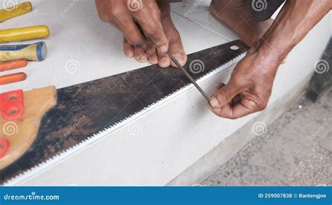 Manual Sharpening Process Of An Old Rusty Saw Tooth Carpentry Hand Tool