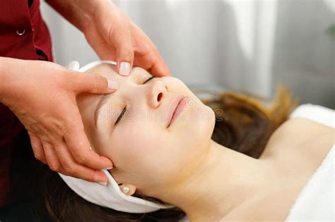 Close Up Photo Of A Beautiful Relaxed Woman Undergoing Acupressure