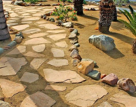 This Landscape Uses Decomposed Granite Along With Flagsto Drought