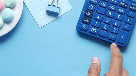man hand using calculator on office desk 23162489 stock video at vecteezy