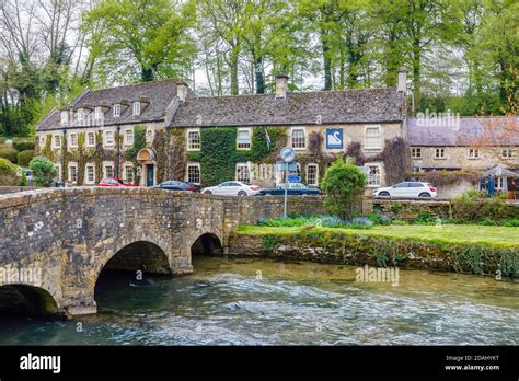 The Swan Hotel And Cotswold Stone Bridge Over The River Coln In Bibury