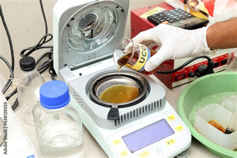 Laboratory Workers Test The Water Content In The Oil Or The Water Content In The Oil Using An