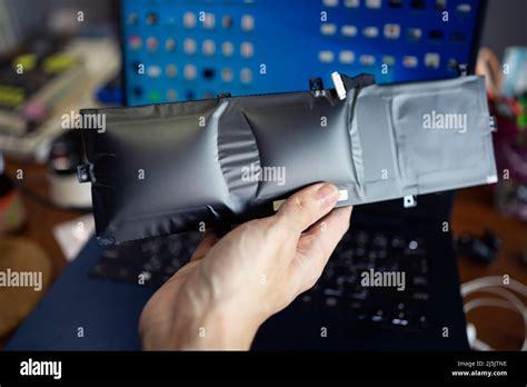 Swollen Laptop Battery In A Hand Stock Photo Alamy